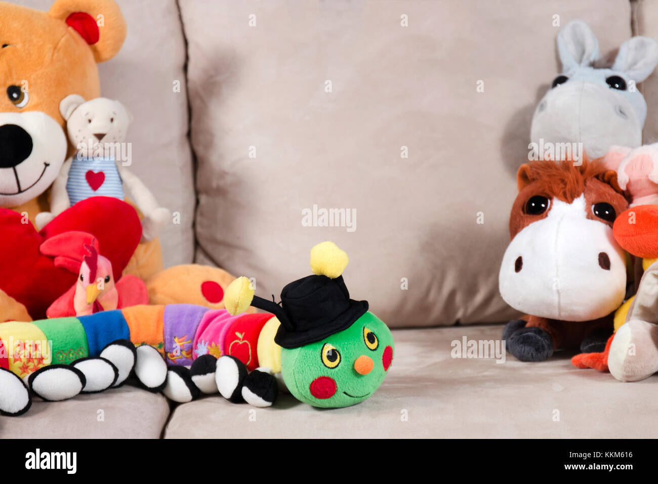 Group of stuffed toys on a sofa Stock Photo - Alamy