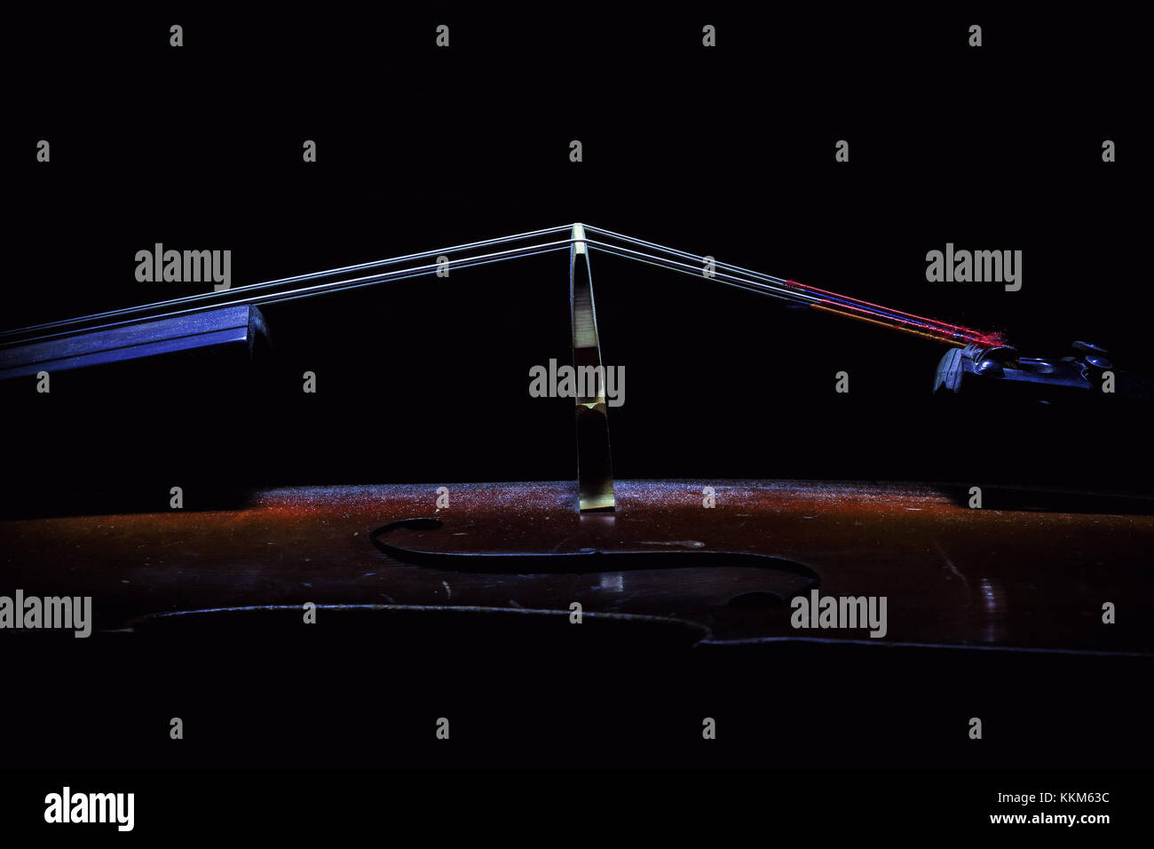 Closeup view of an old dusty cello, accentuated shapes with light Stock ...