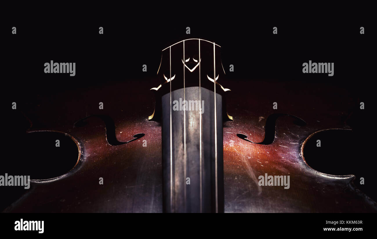 Closeup view of an old dusty cello, accentuated shapes with light Stock ...