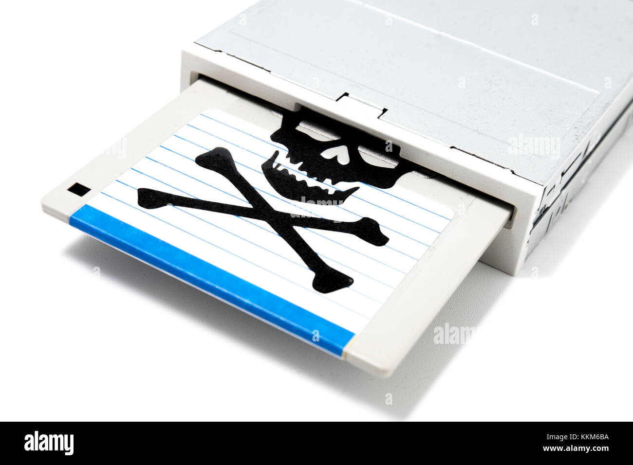 Close up view of a infected computer floppy disk being inserted on ...