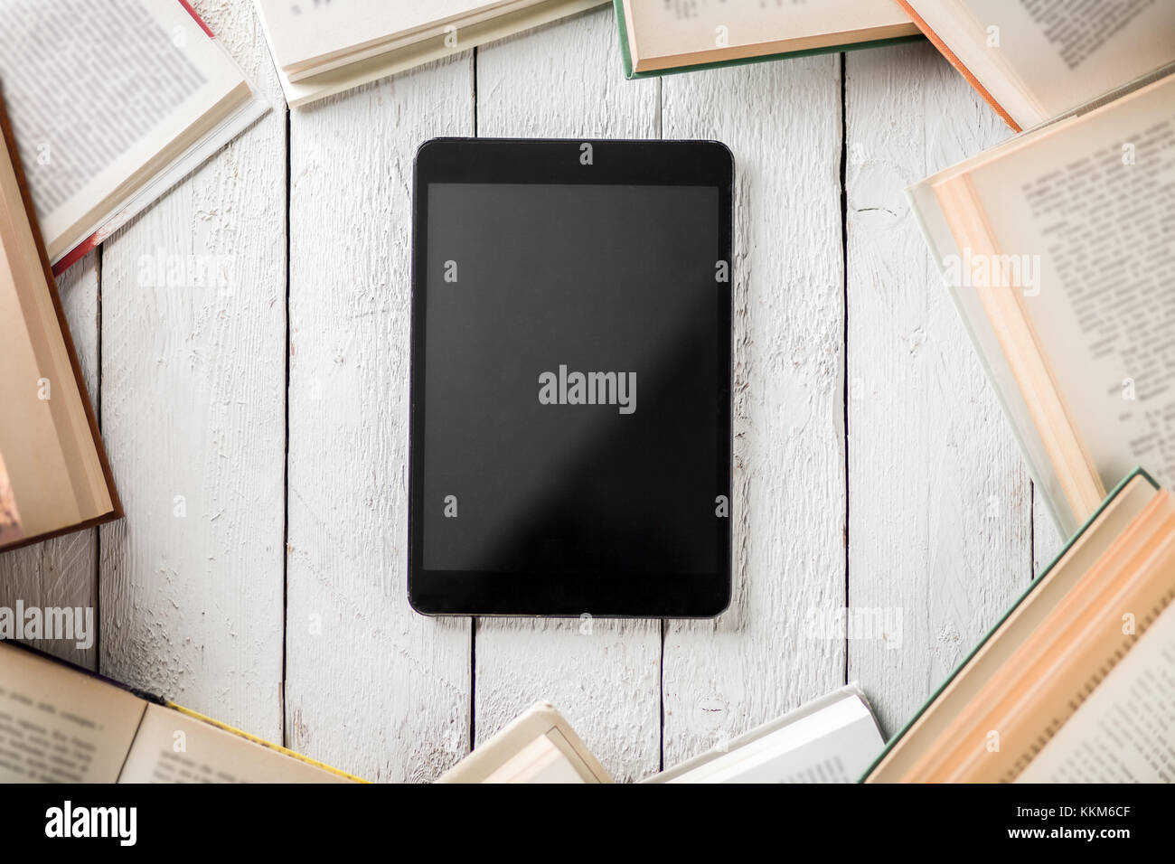 Black Ebook Reader with Many Paper Books Stock Photo - Alamy