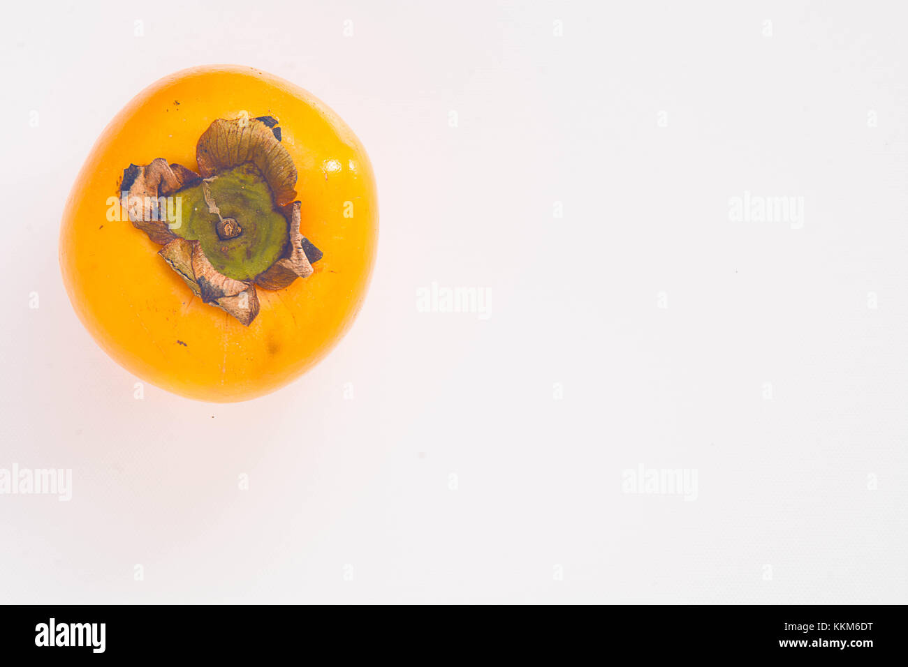 Fresh natural kaki fruits in the basket on white background Stock Photo ...