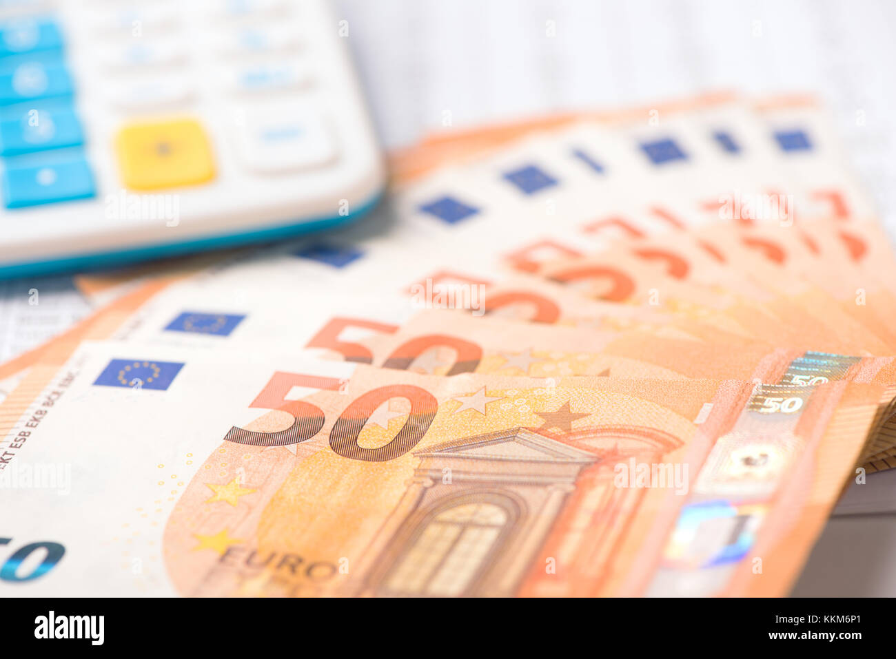 Euro money and calculator Stock Photo - Alamy