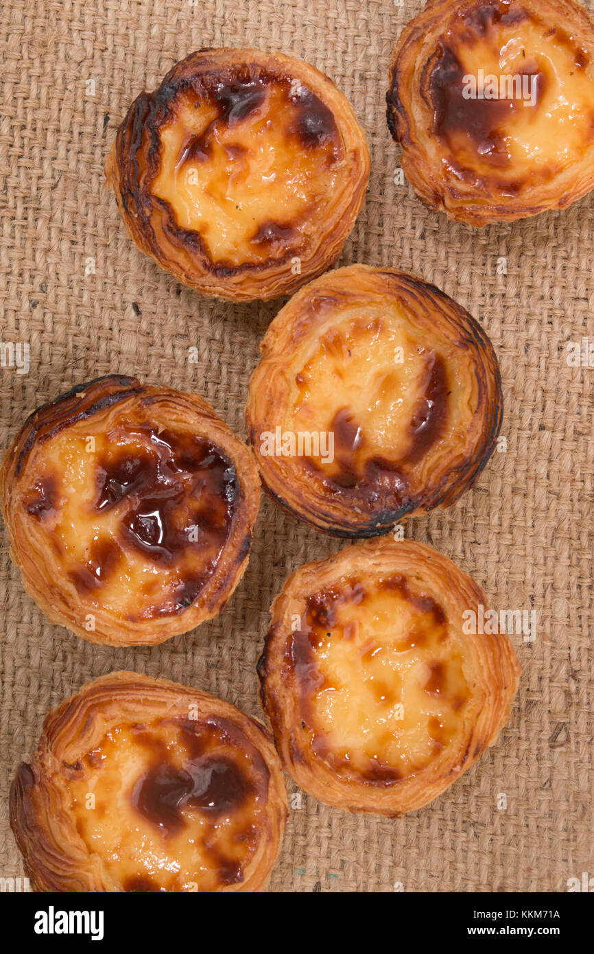 Famous Portuguese egg pastry tart called 'Pastel de Belem' on hessian ...