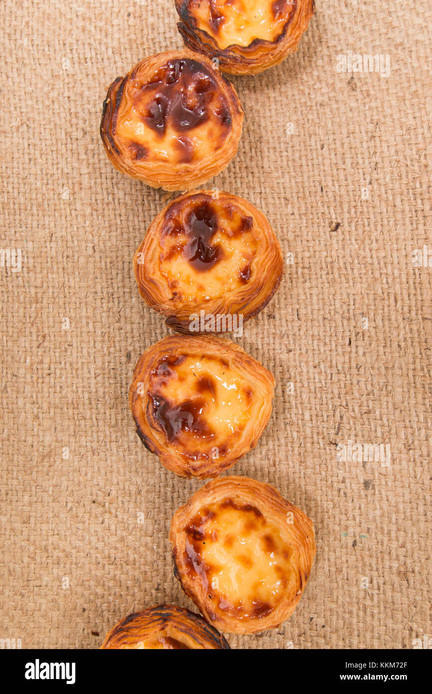 Famous Portuguese egg pastry tart called 'Pastel de Belem' on hessian ...