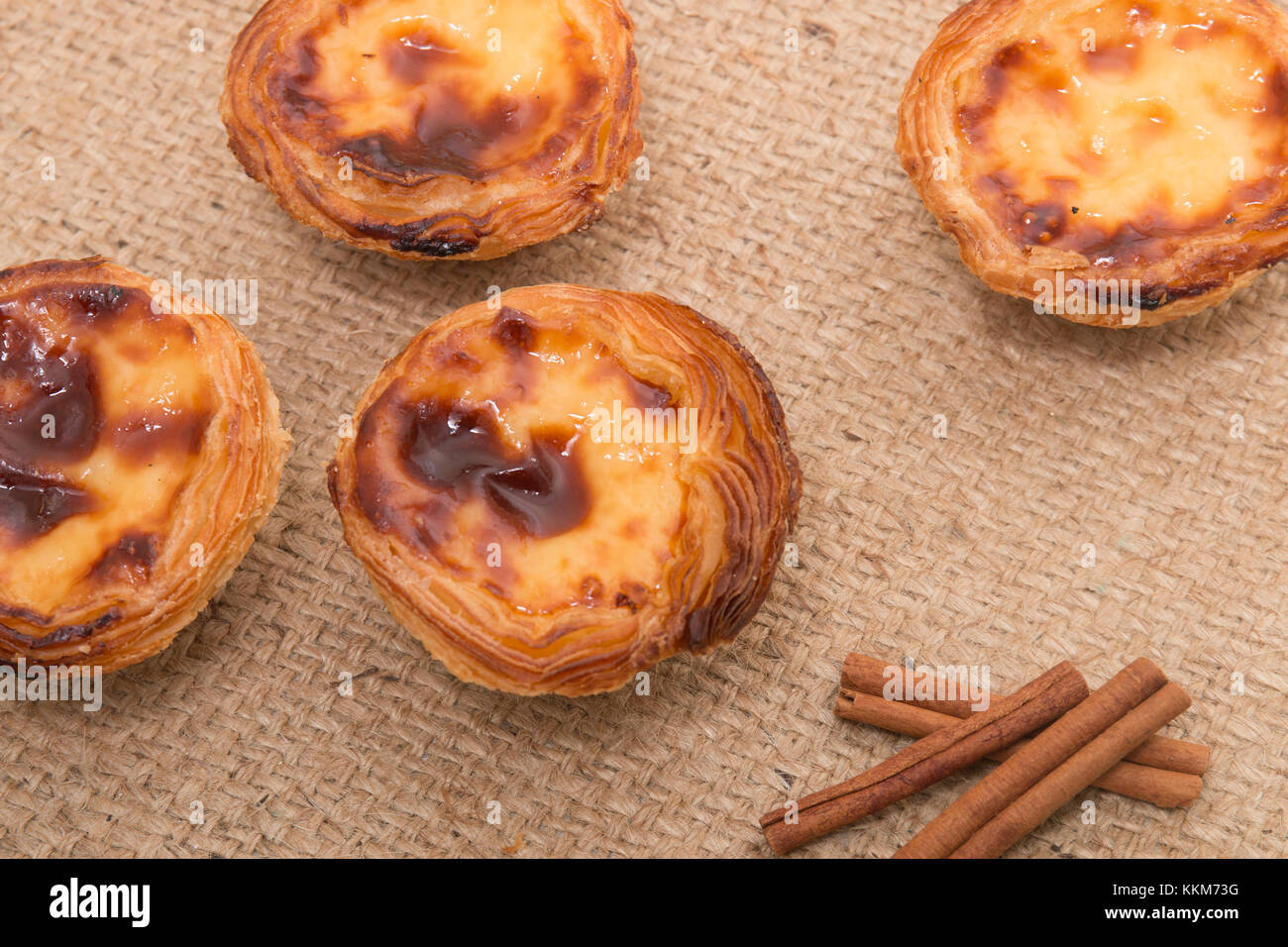 Famous Portuguese egg pastry tart called 'Pastel de Belem' on hessian ...