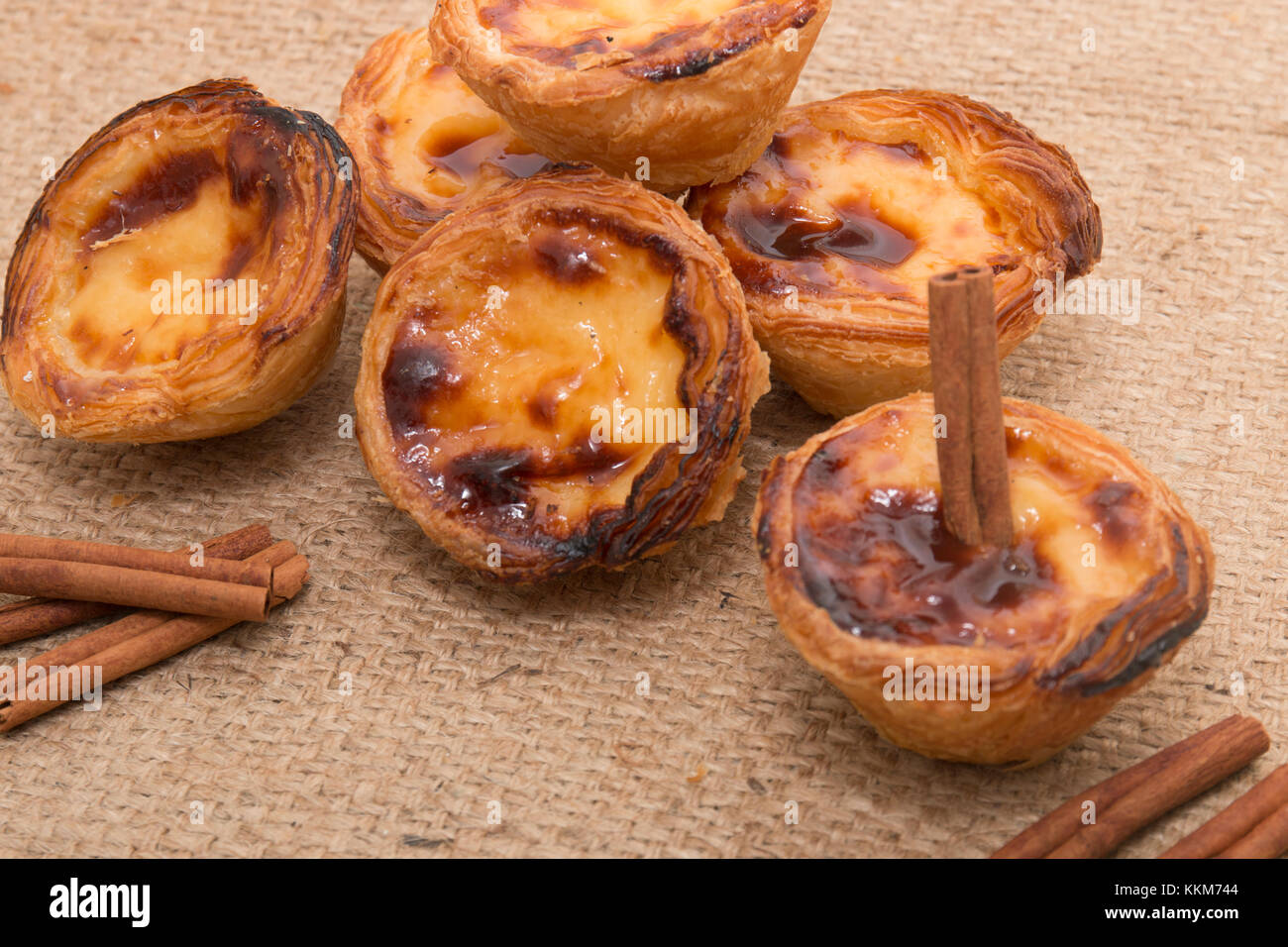 Famous Portuguese egg pastry tart called 'Pastel de Belem' on hessian ...