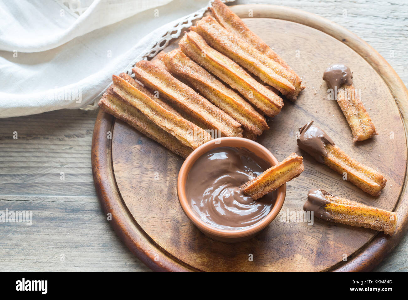 Churros - famous Spanish dessert with chocolate sauce Stock Photo - Alamy