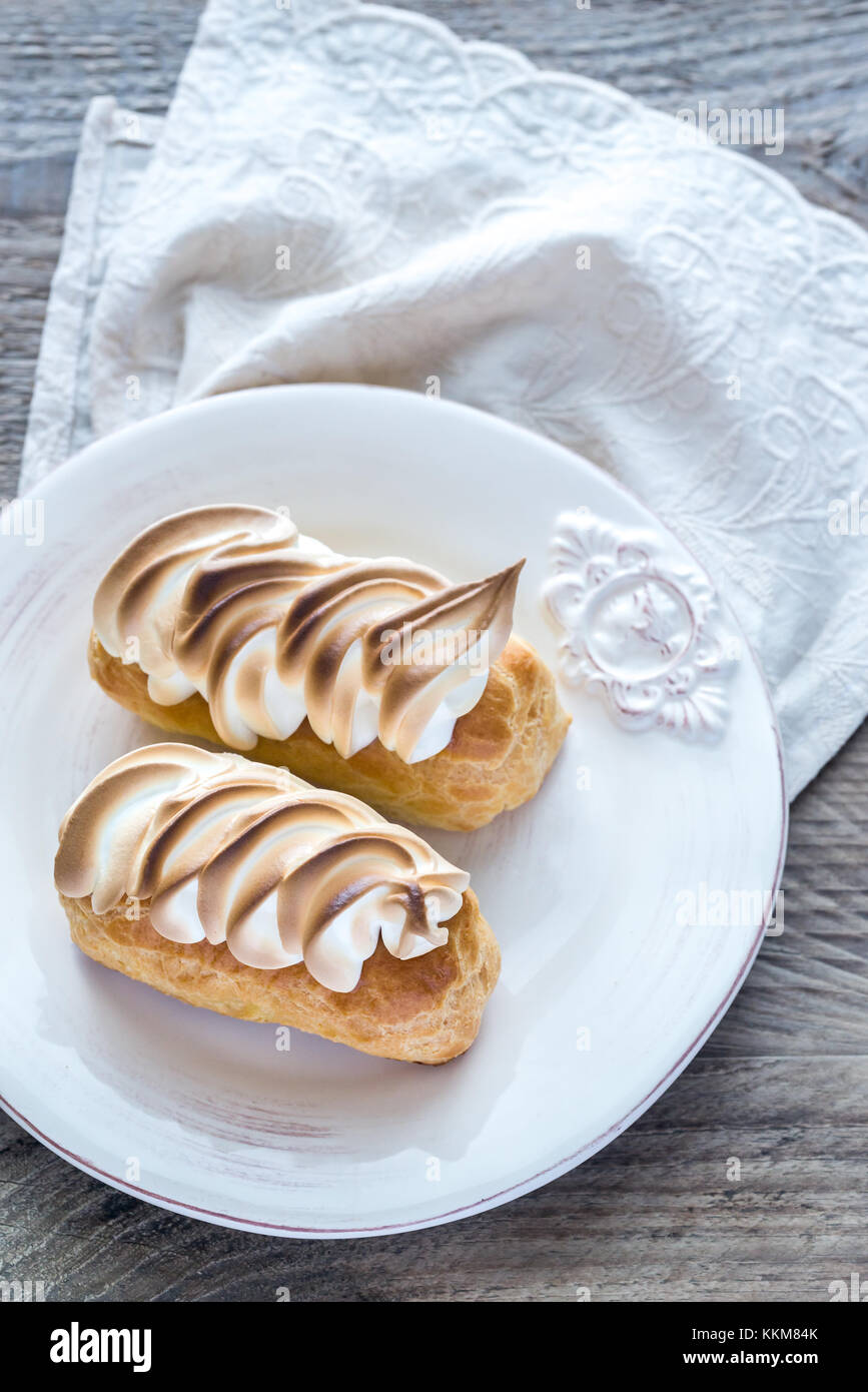 Eclairs with lemon curd and meringue Stock Photo - Alamy