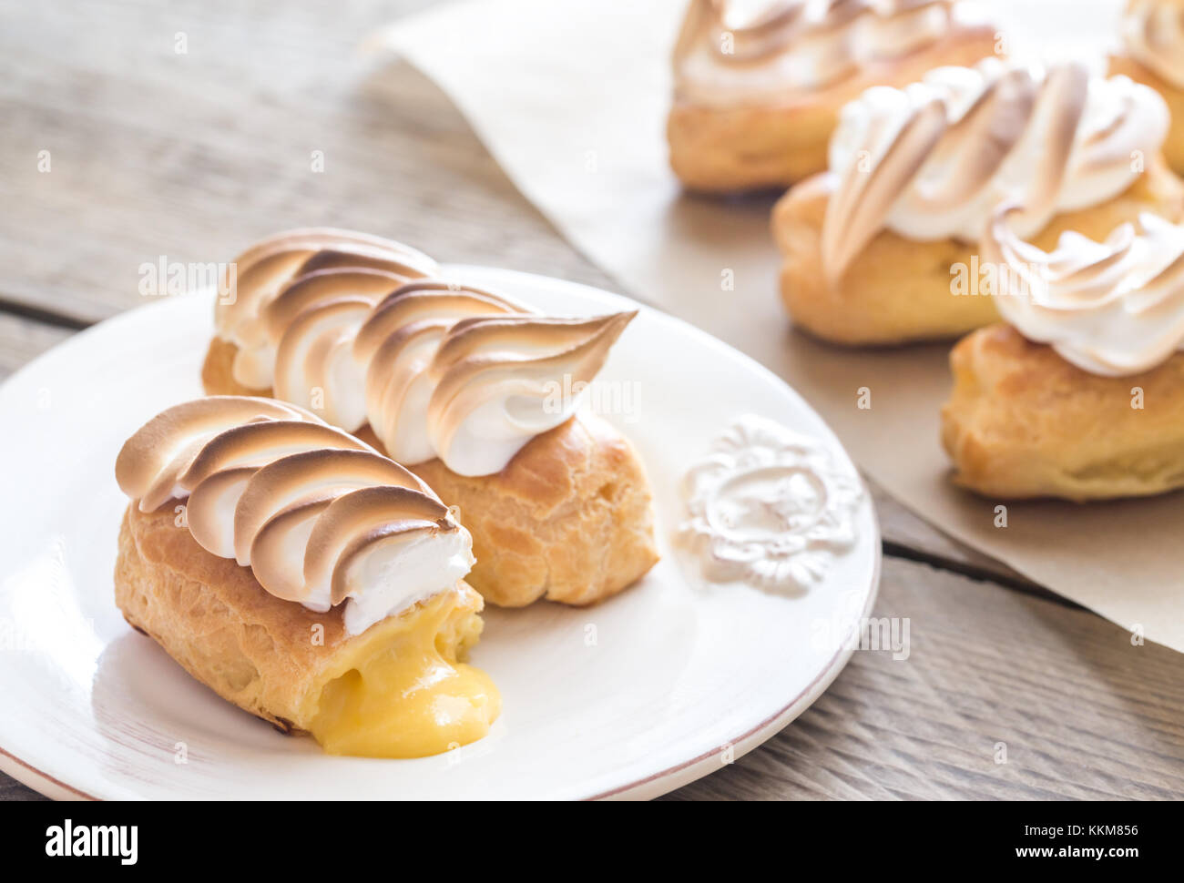 Eclairs with lemon curd and meringue Stock Photo - Alamy