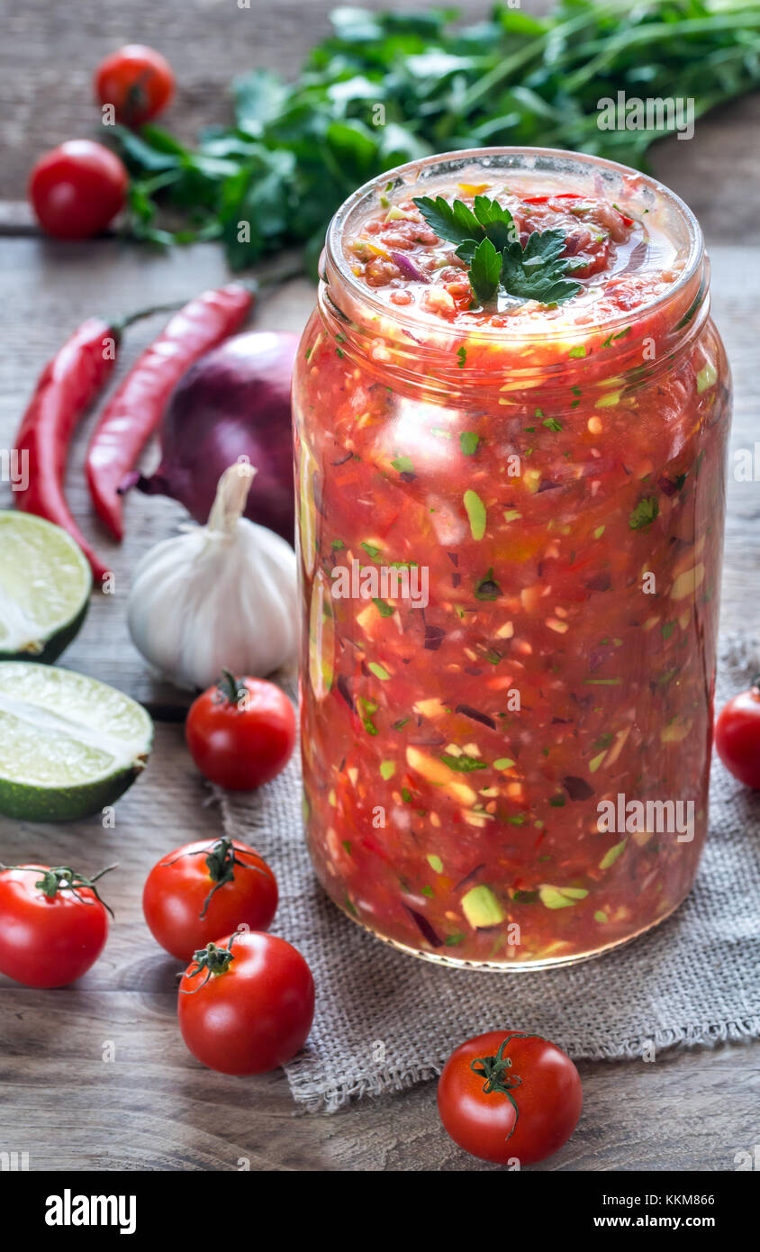 Jar of salsa with ingredients Stock Photo - Alamy