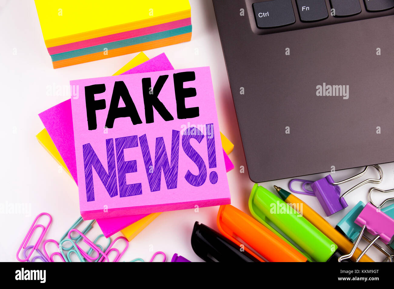Writing text showing Fake News made in the office with surroundings ...