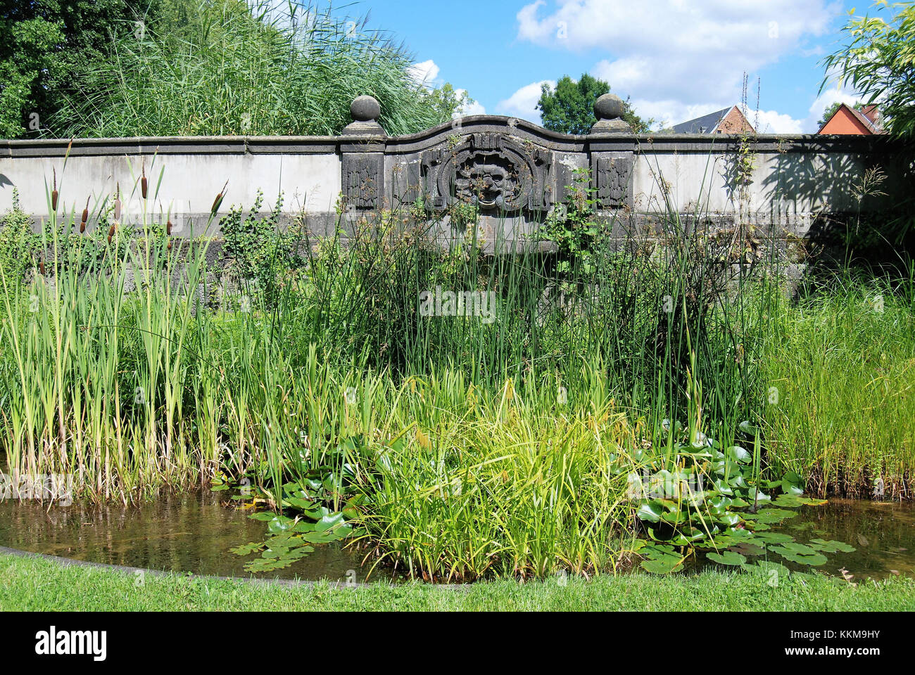 Pond landscape with historical bridge in the botanical garden in ...