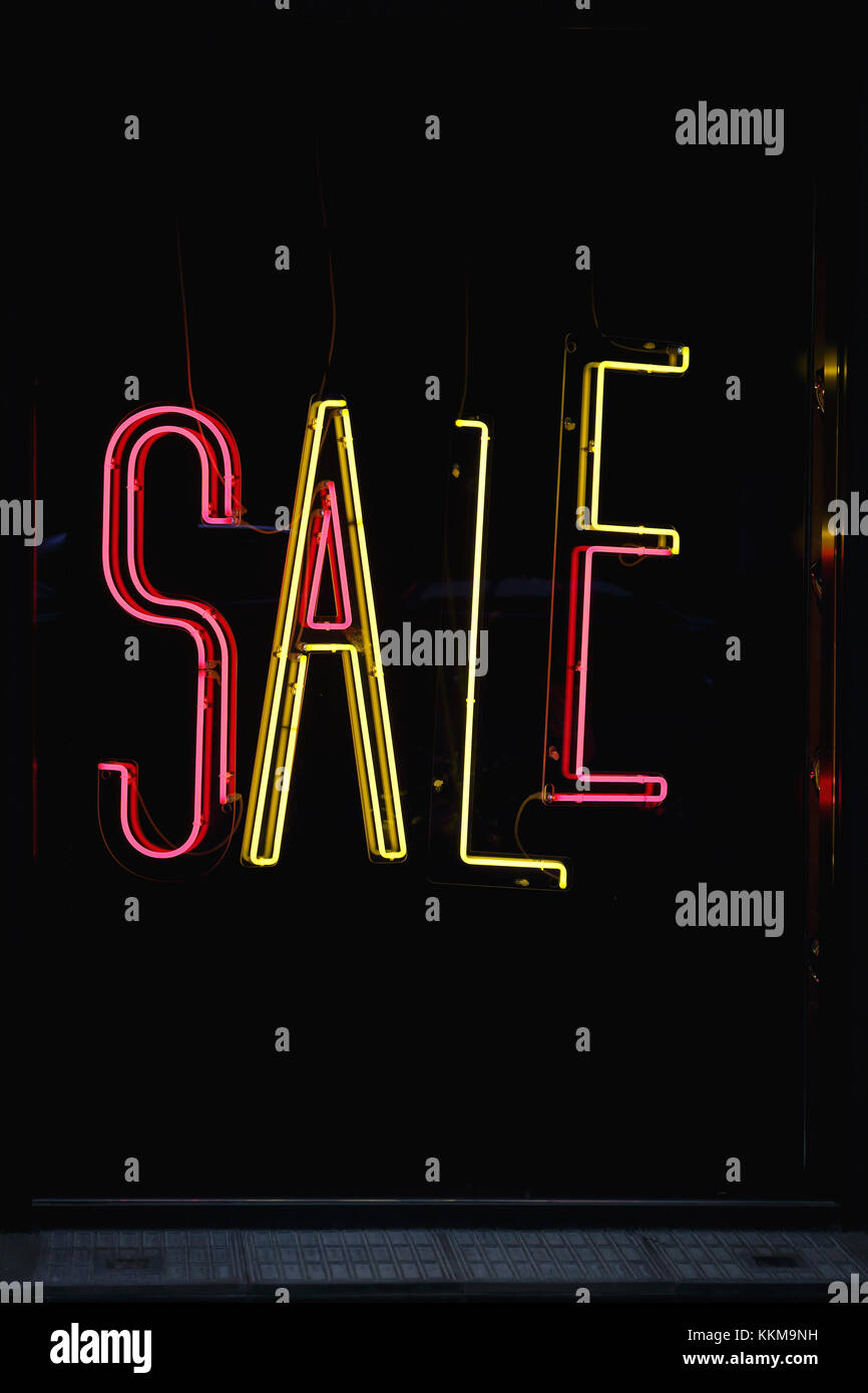 Neon Lights Sale Sign in Shop Window Stock Photo - Alamy
