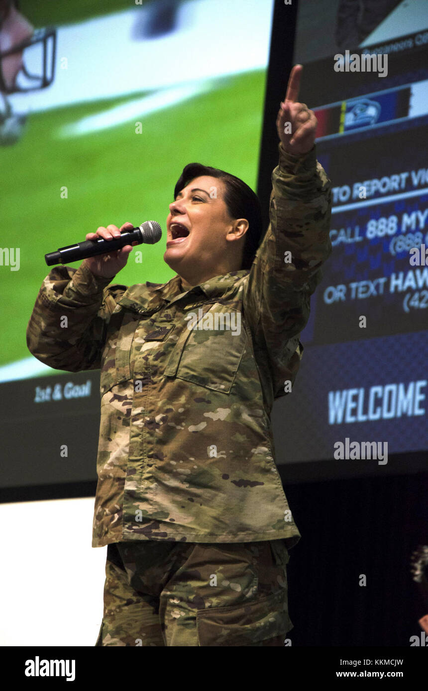 Sgt. Charyl Sagar, 133rd Army Band, sings during a performance for the ...