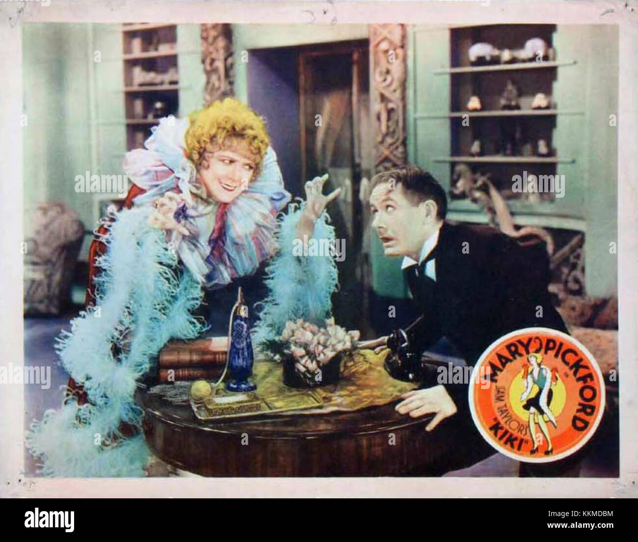 The lobby card for 'Kiki' features the vibrant atmosphere of the film ...