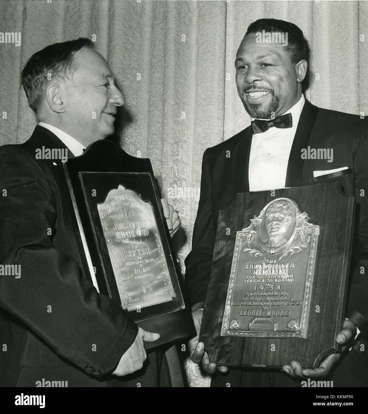 This image captures Sam Taub and Archie Moore in 1959. Archie Moore, a ...