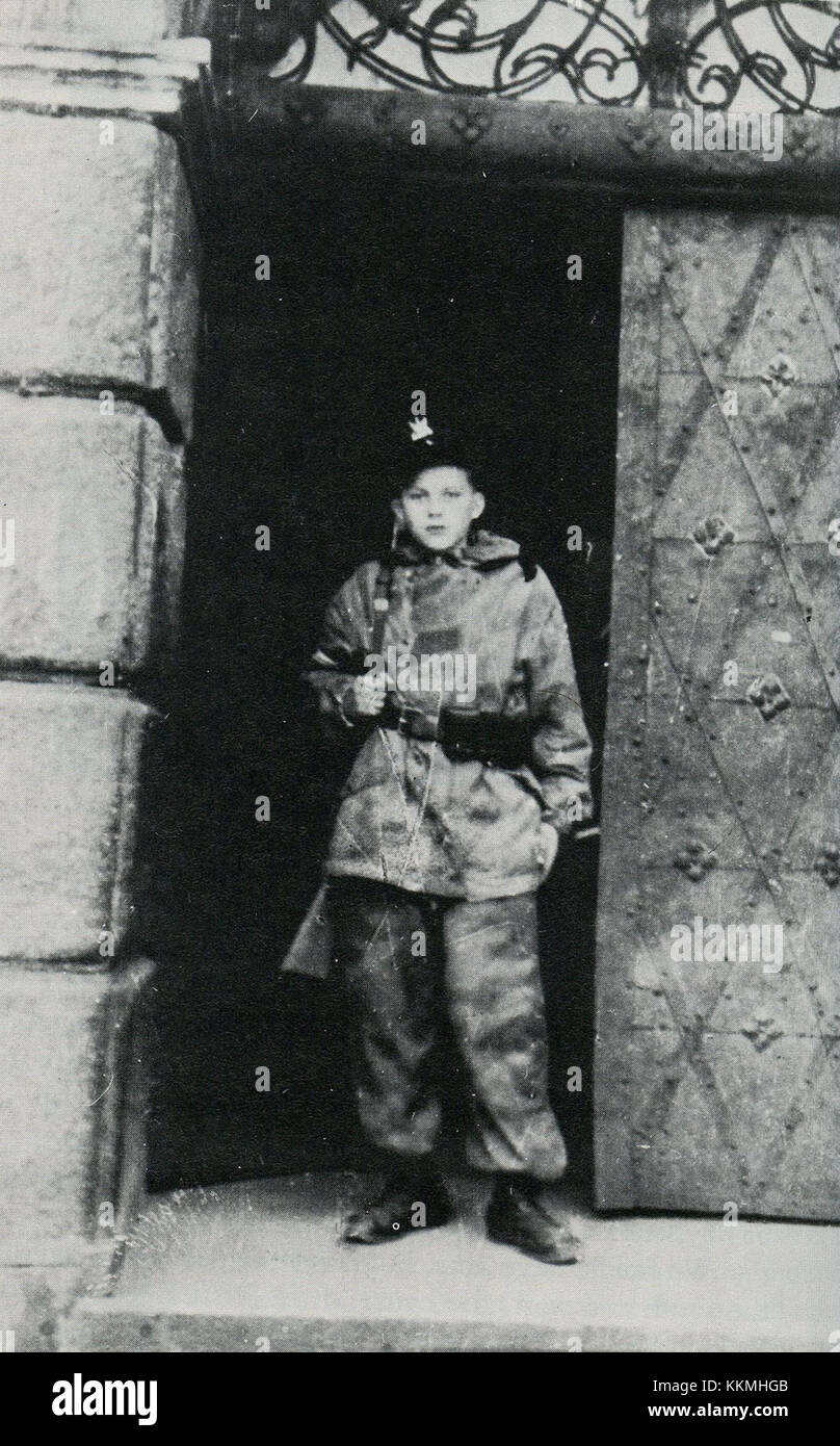 The image depicts a young insurgent during the Warsaw Uprising in 1944 ...