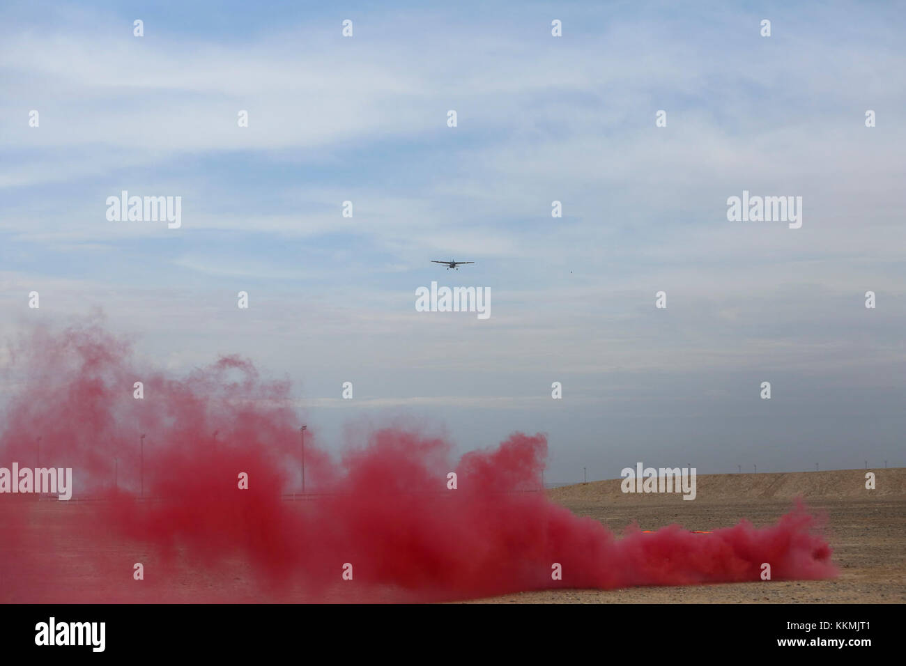 An Afghan Air Force C-208 prepares to airdrop water during a resupply ...