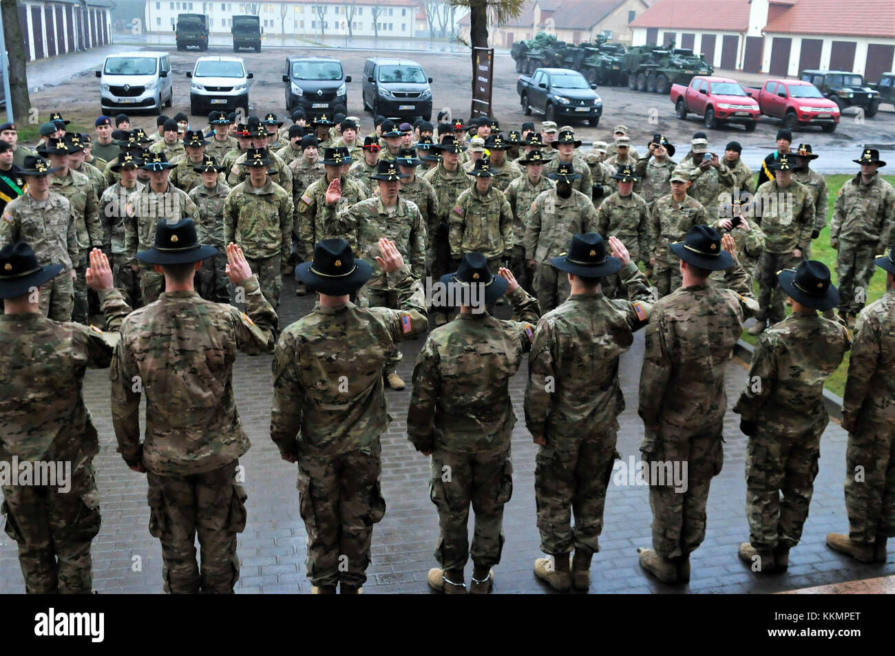 Lt. Col. Scott Cheney, the Battle Group Poland commander, administers ...