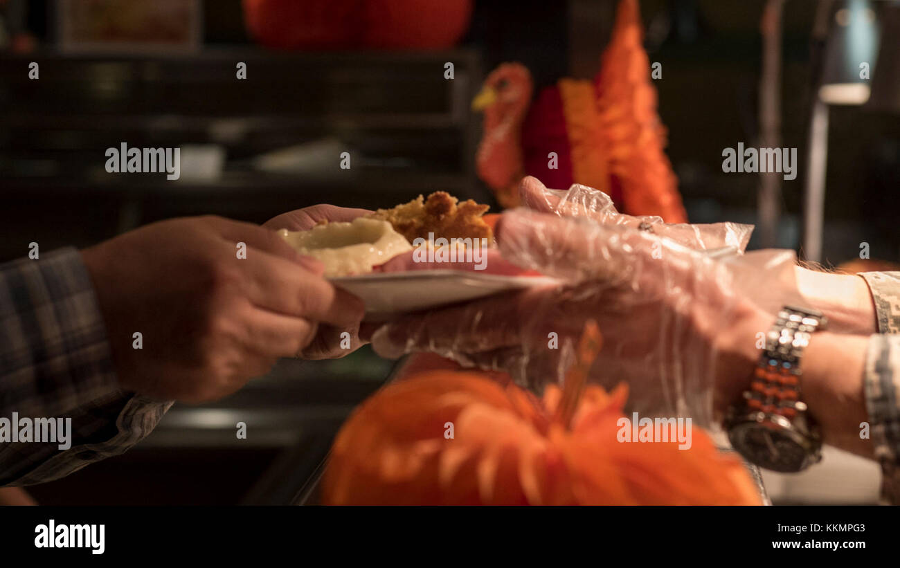 A Langley Air Force Base leader serves Thanksgiving lunch at the ...