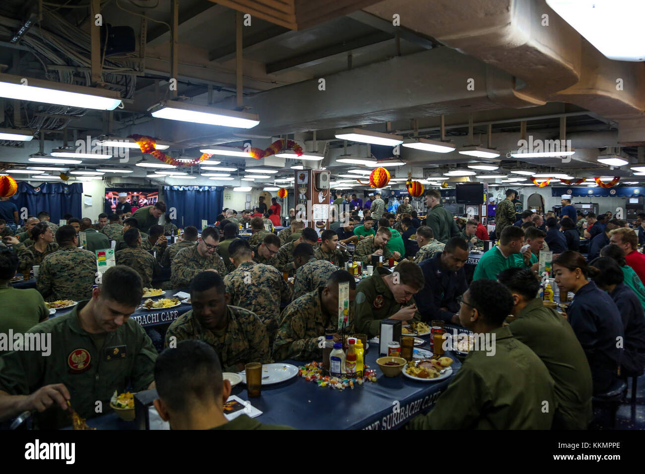 U.S. Marines and Sailors eat during Thanksgiving dinner aboard the ...