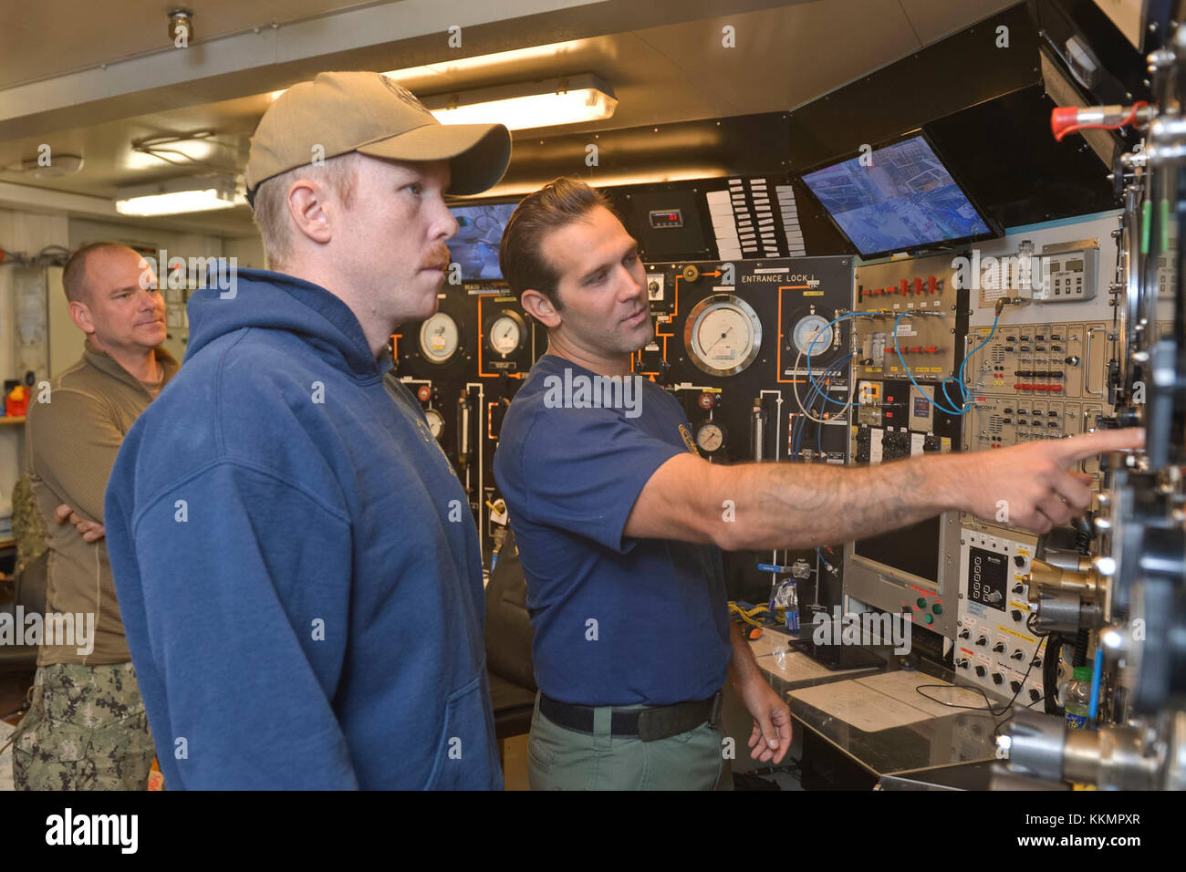 ATLANTIC OCEAN (Nov. 23, 2017) Navy Diver 1st Class Chris Maggs, right ...