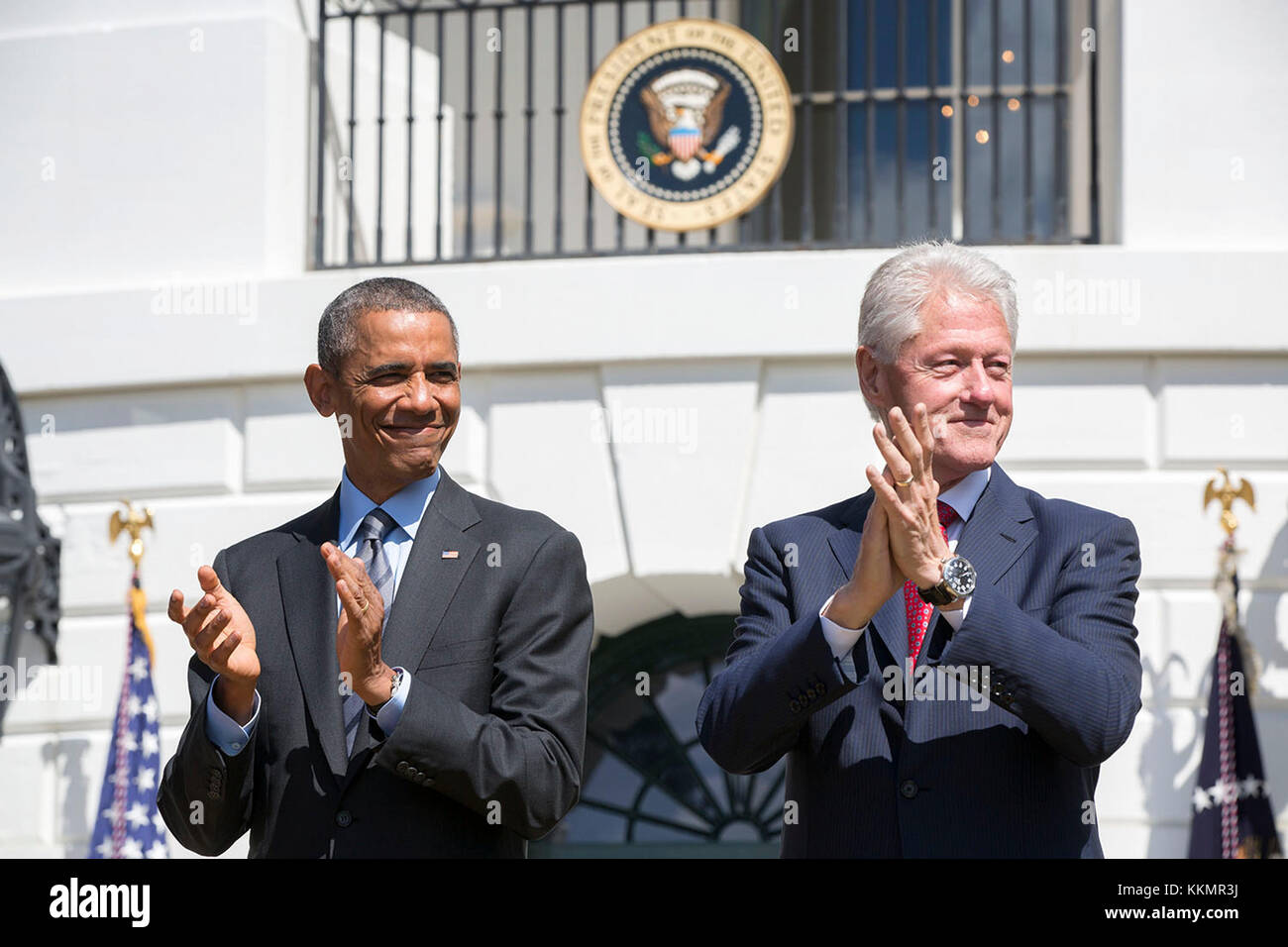 President Barack Obama and former President Bill Clinton applaud during ...