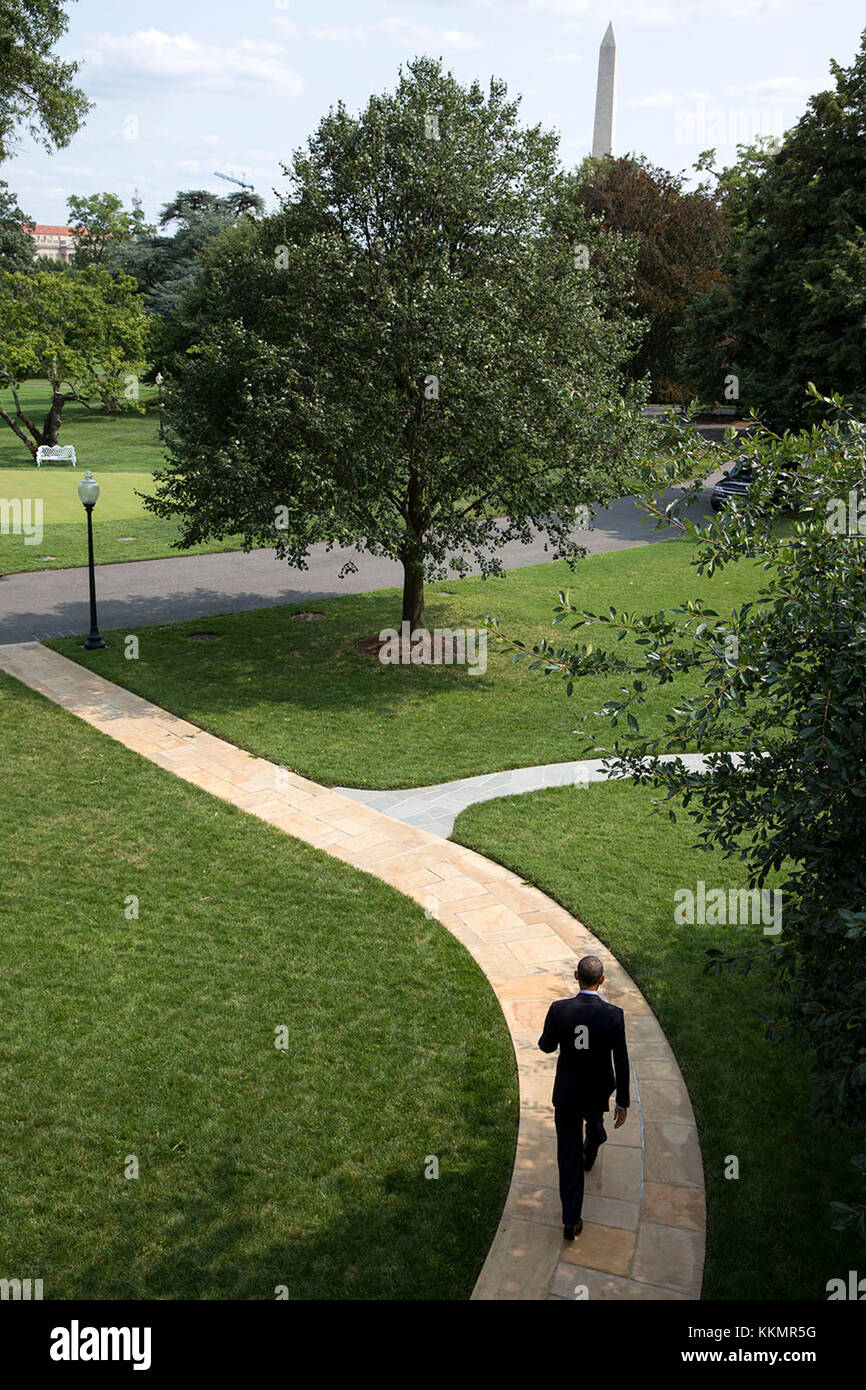 President Barack Obama walks from the Oval Office to deliver a ...
