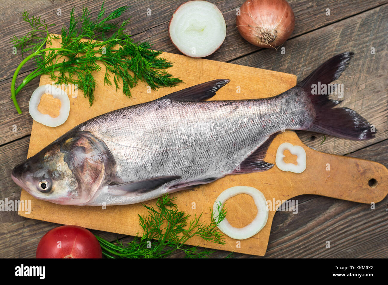 Fresh fish on a wooden table Stock Photo - Alamy