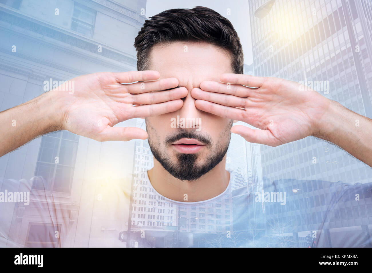 Disturbed bearded male person covering his eyes Stock Photo - Alamy