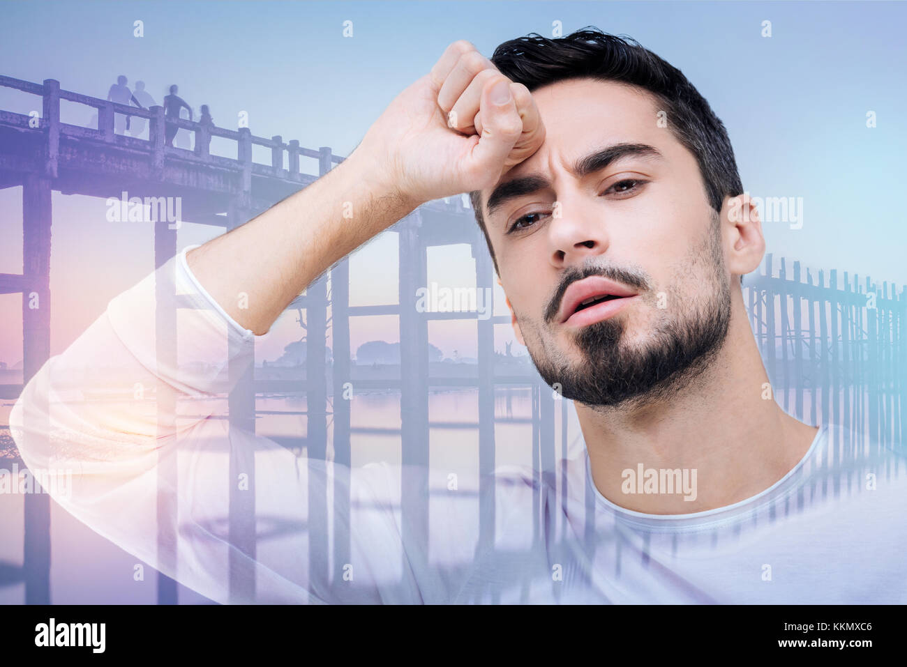 Tired male person looking downwards Stock Photo - Alamy