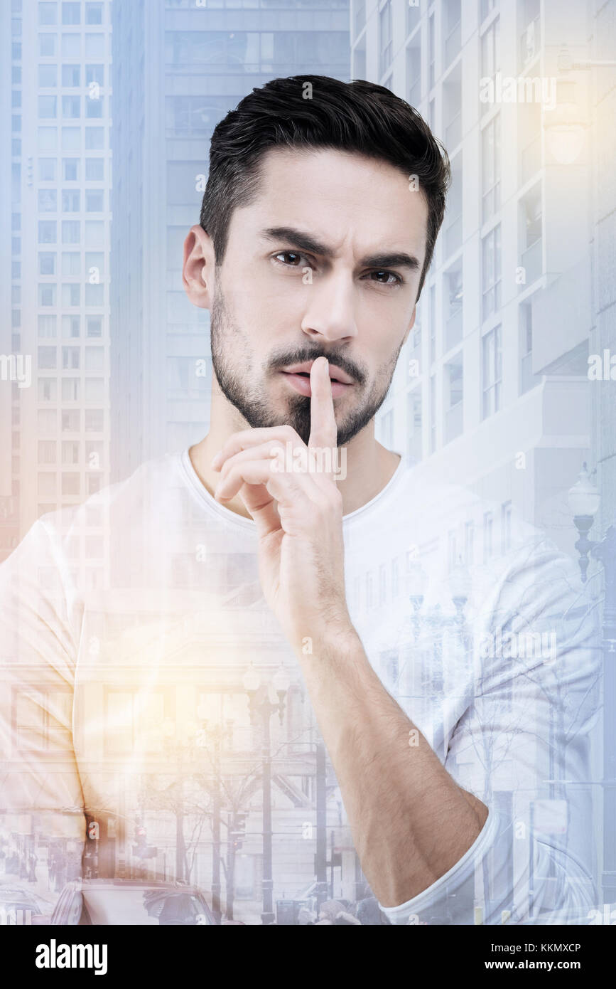Attractive male person looking straight at camera Stock Photo - Alamy