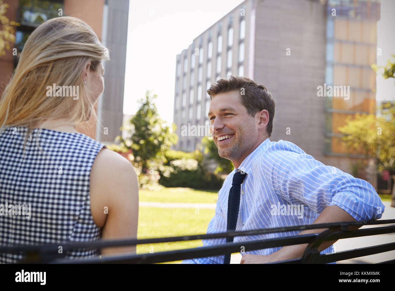 Two people talking sitting in a park hi-res stock photography and ...