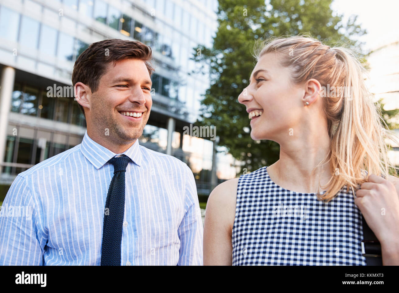 Businesspeople Walking Past Modern City Offices On Way To Work Stock ...
