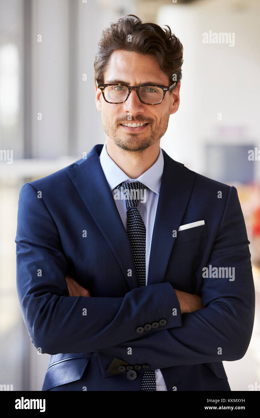 Man wearing suit crossed arms hi-res stock photography and images - Alamy