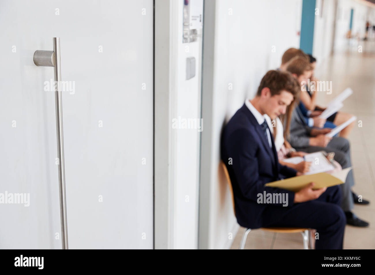 Five candidates waiting for job interviews, elevated view Stock Photo ...