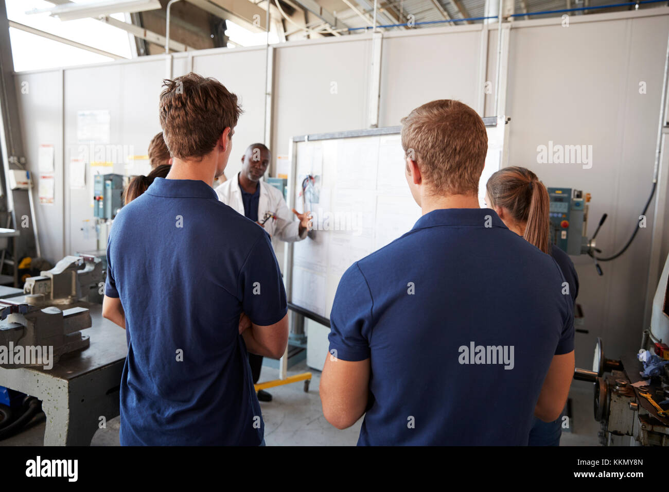 Engineering apprentices at a training presentation, back view Stock ...