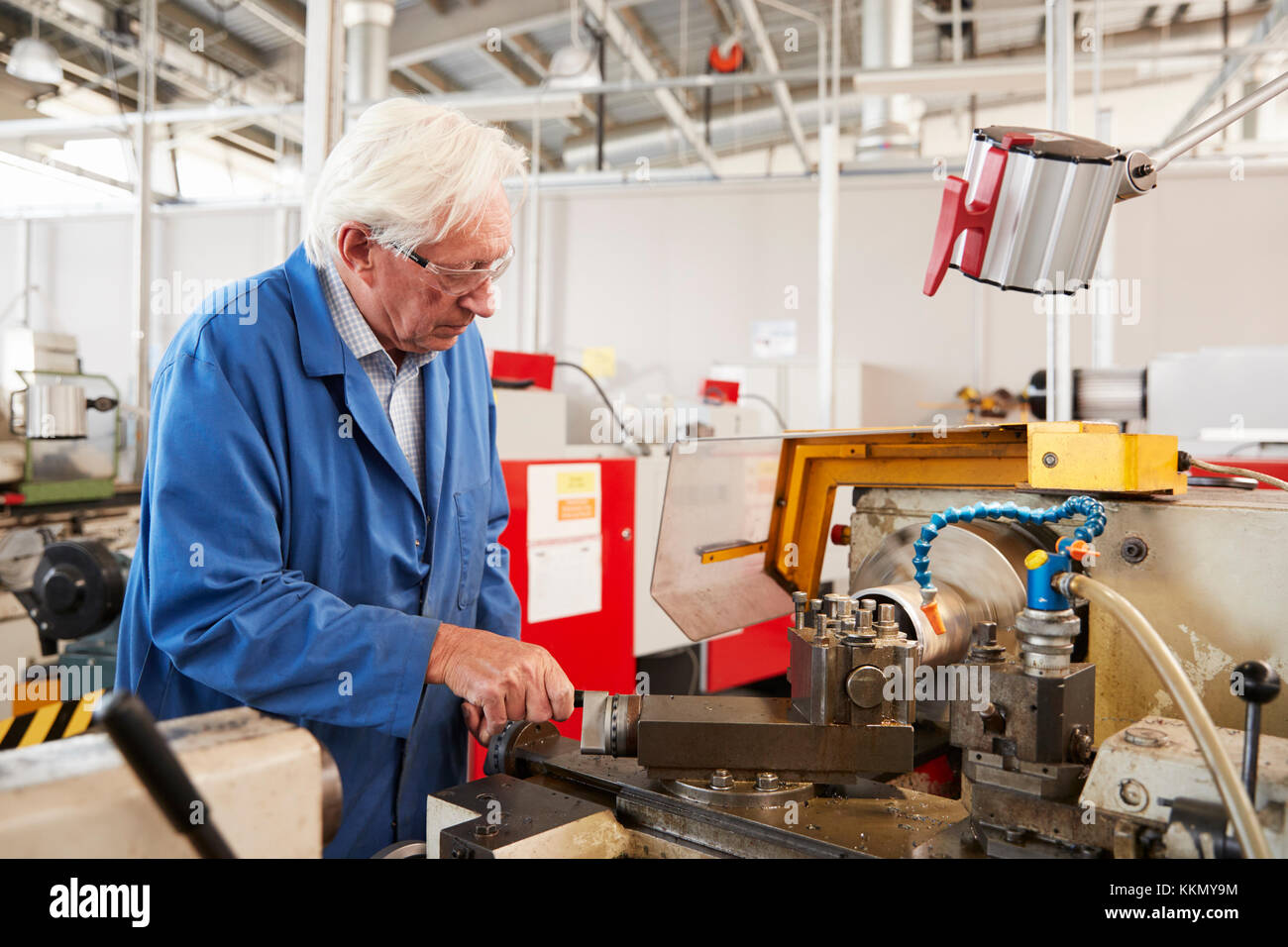 Senior engineer working in a factory, close up Stock Photo - Alamy