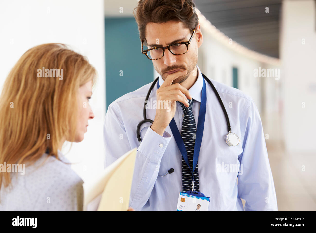 Two doctors talking hospital hi-res stock photography and images - Alamy