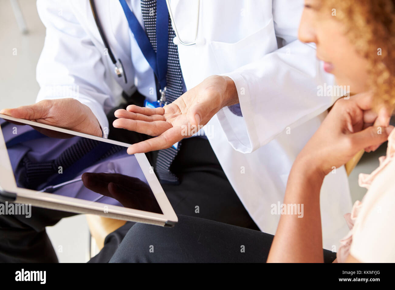Two senior doctors using tablet computer, mid section Stock Photo - Alamy