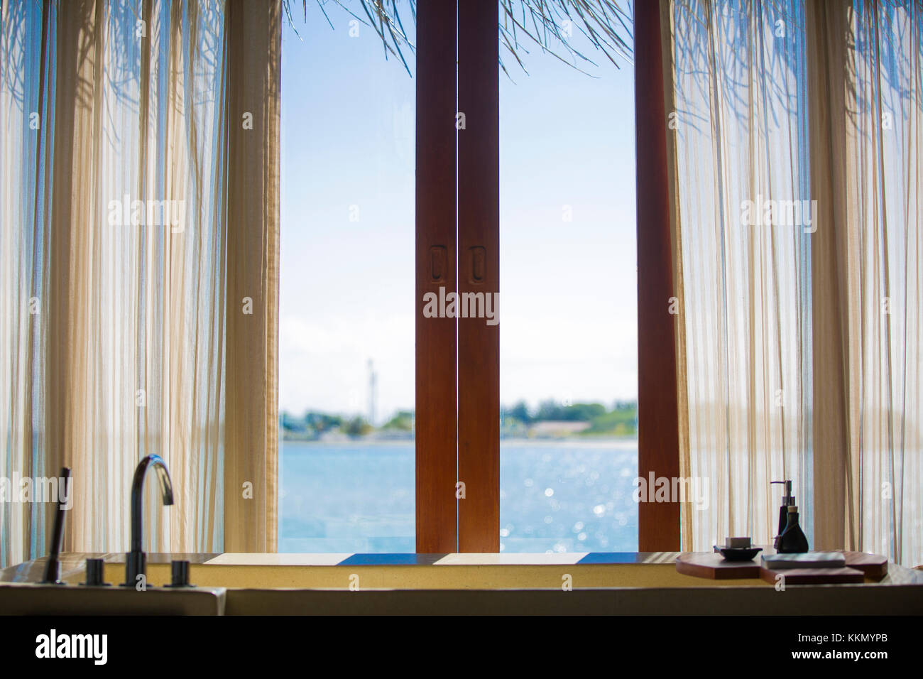 Inside an over water bungalow in a tropical island. The shot is from ...