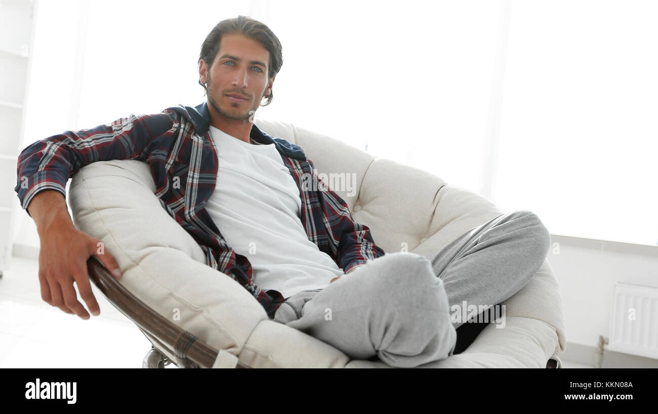 successful guy resting in modern living room Stock Photo - Alamy