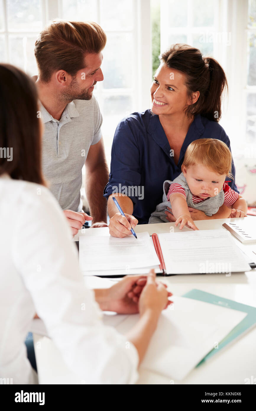 Family With Baby Meeting Financial Advisor At Home Stock Photo - Alamy