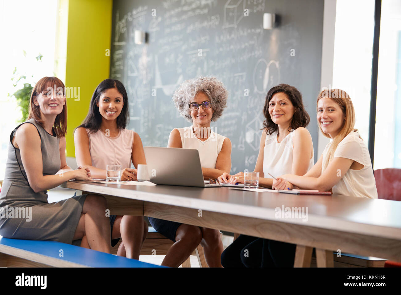 Female work colleagues at informal meeting looking to camera Stock ...