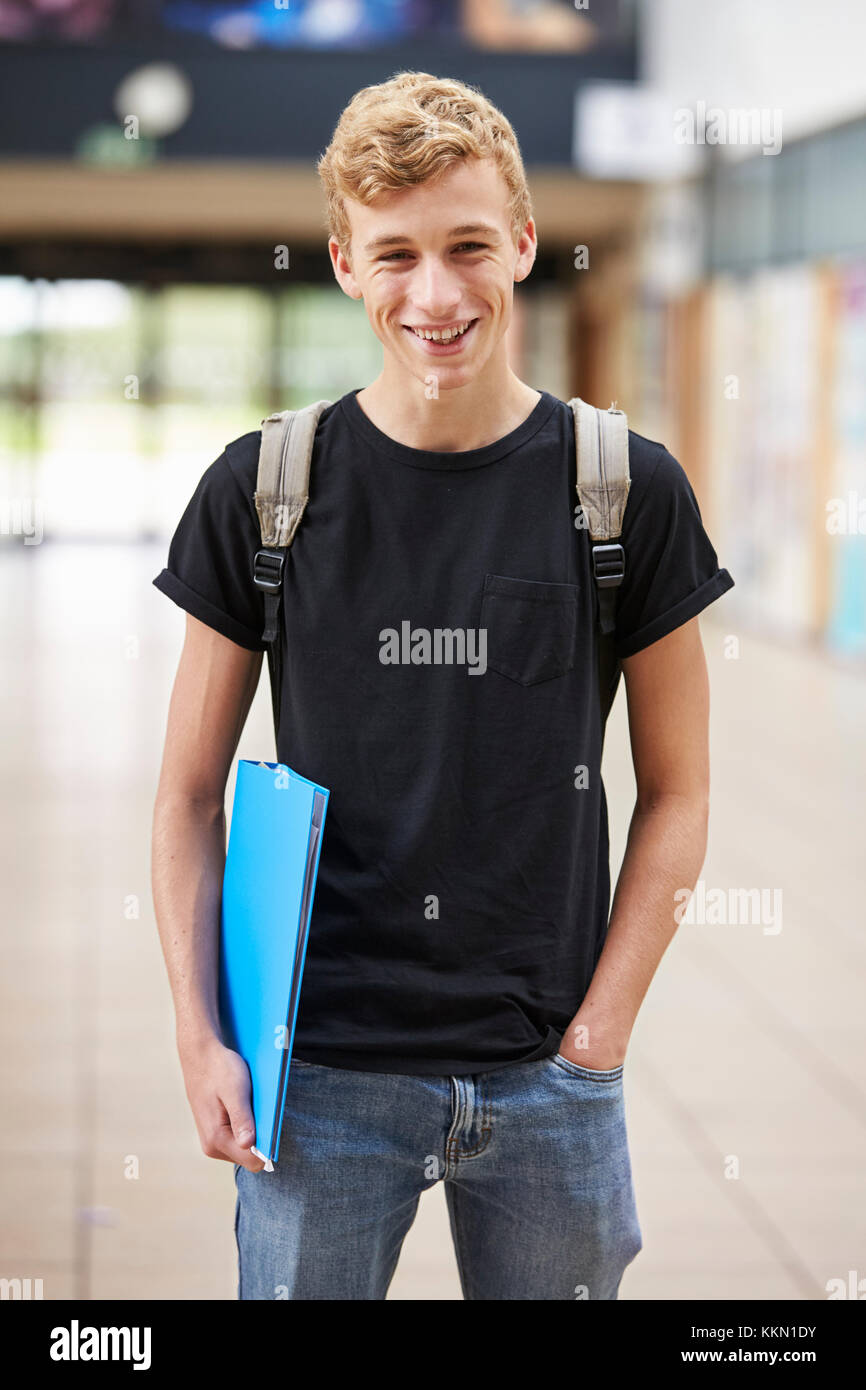 Portrait Of Male Student Standing In College Building Stock Photo - Alamy