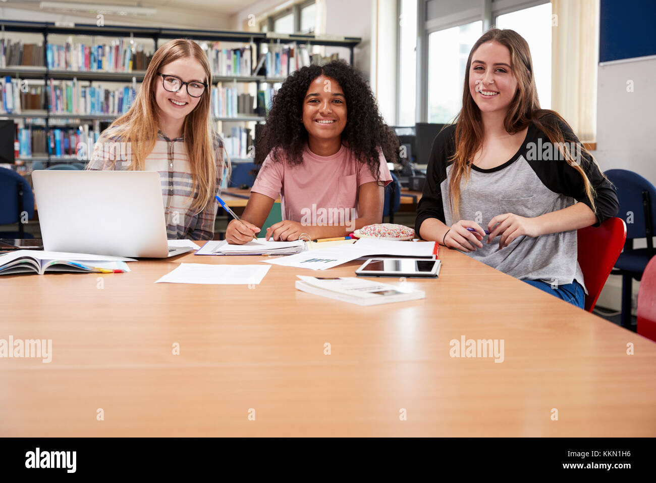 Portrait Of Female College Students Working In Library Together Stock ...