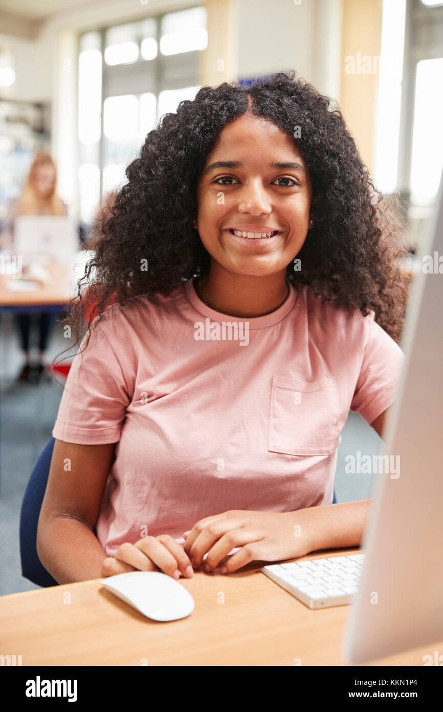 Portrait Of Female Student Using Computer In College Library Stock ...