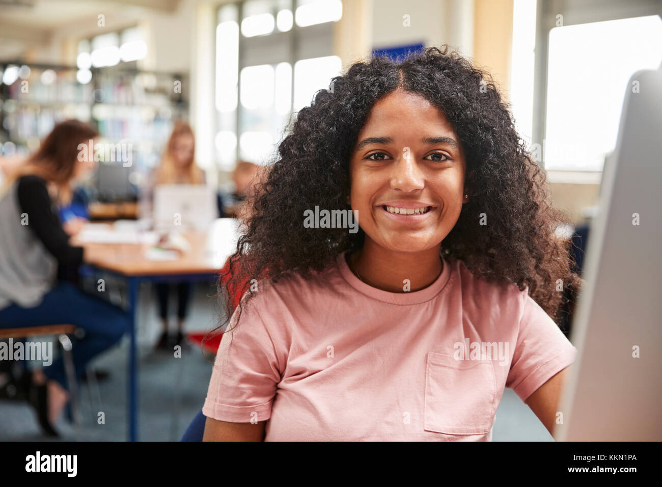 Portrait Of Female Student Using Computer In College Library Stock ...