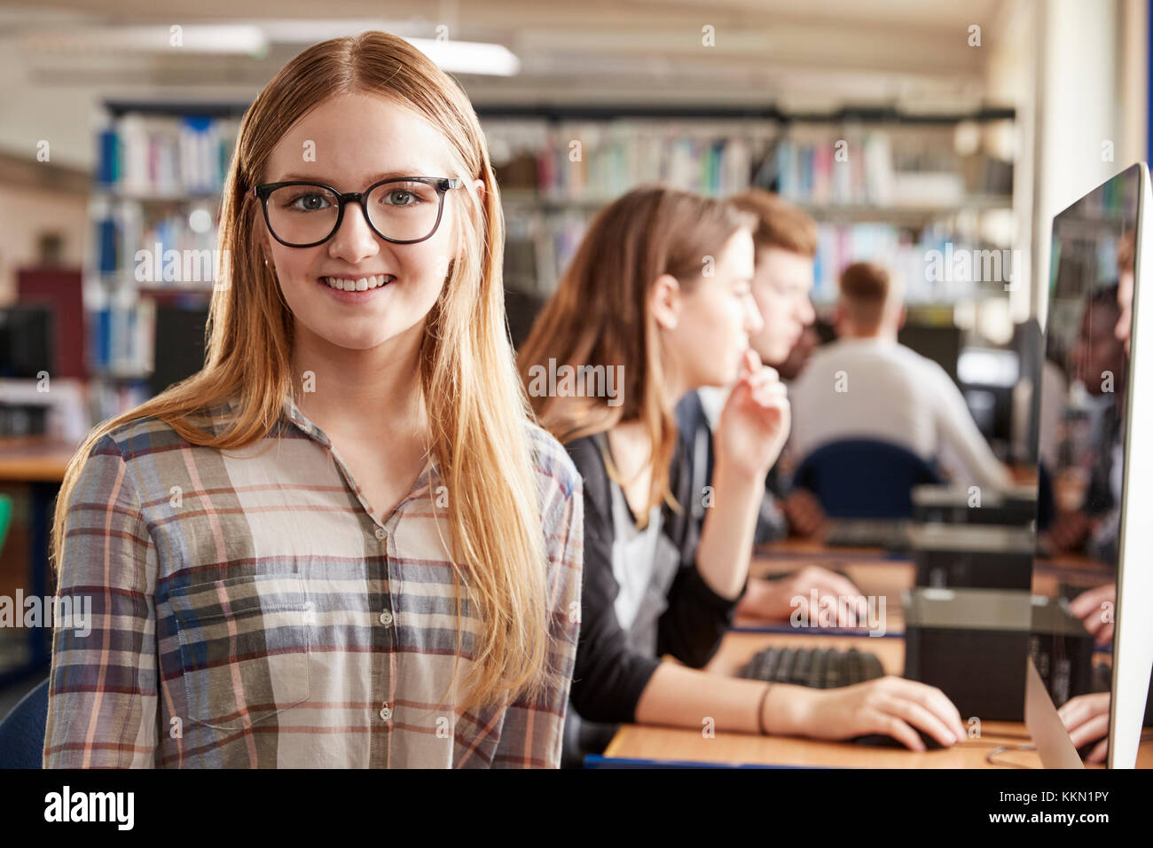 Portrait Of Female Student Using Computer In College Library Stock ...
